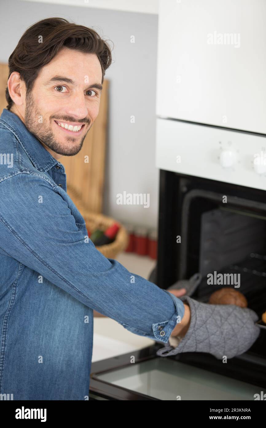 side view portrait of handsome man cooking Stock Photo - Alamy