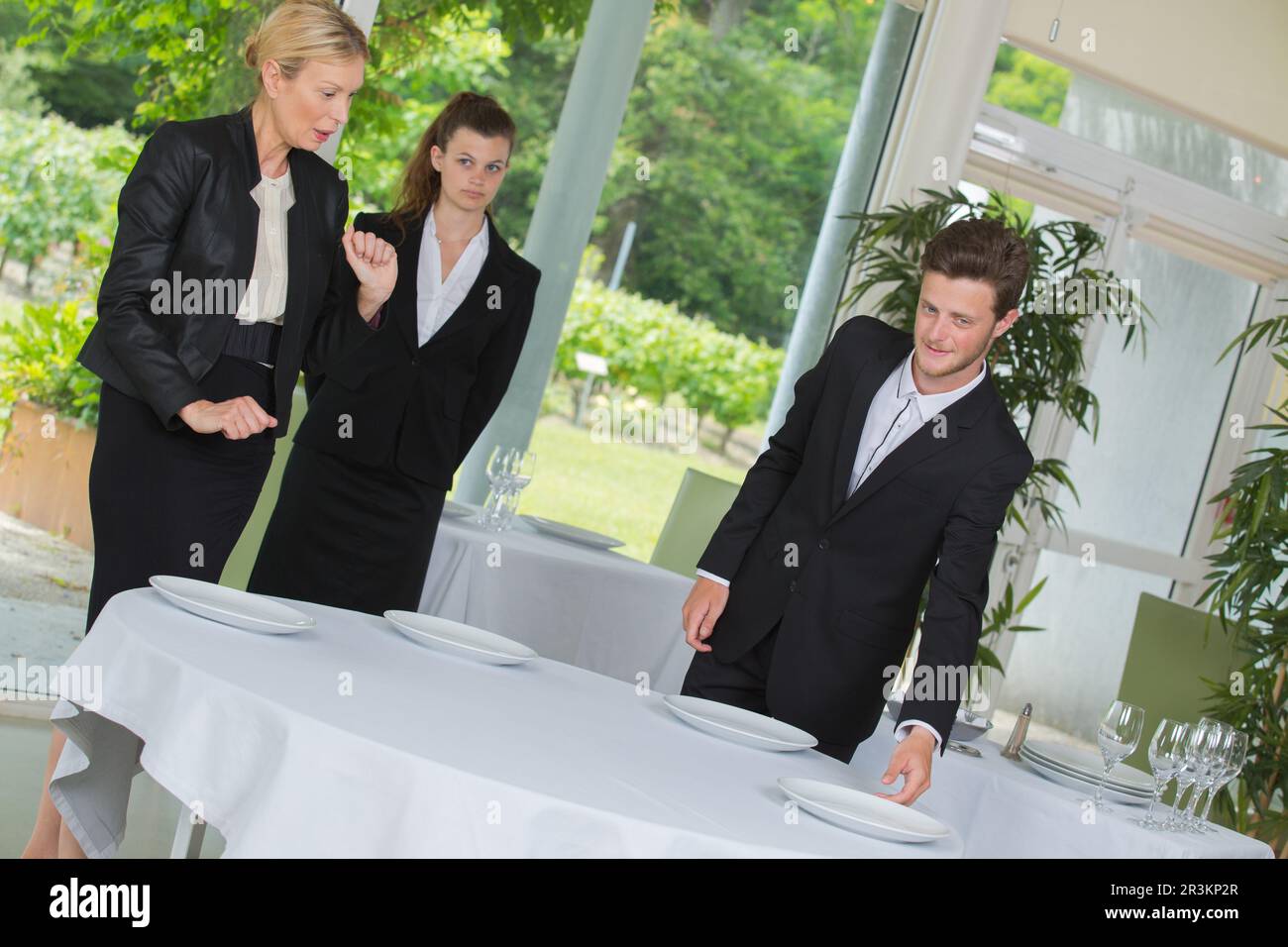 group of waiters at a prestigious restaurant during briefing Stock ...