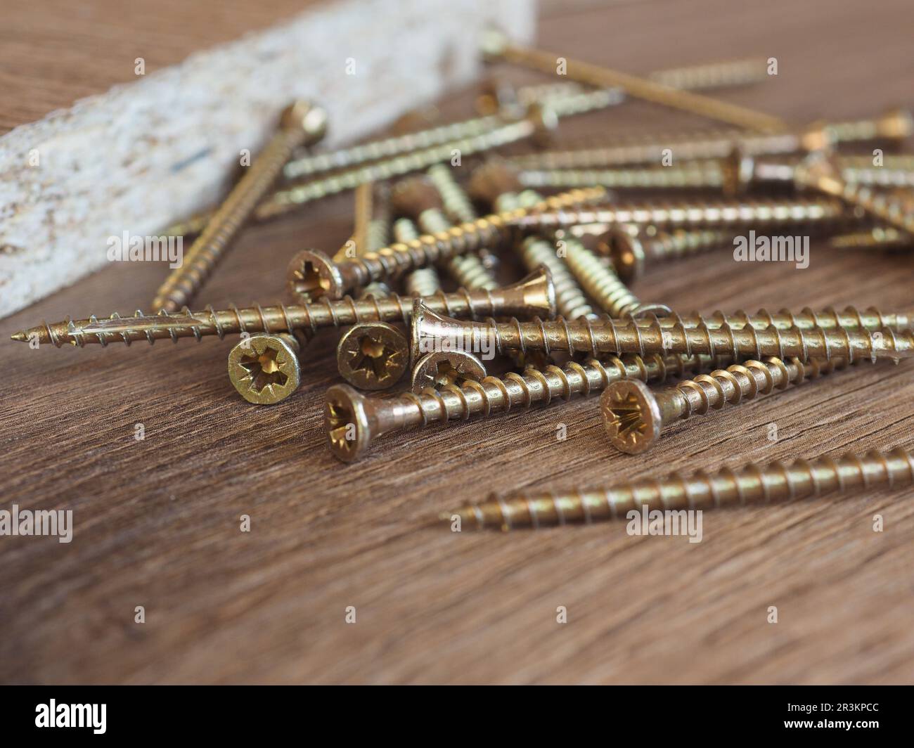 Wood screws on manufactured wood panel Stock Photo - Alamy