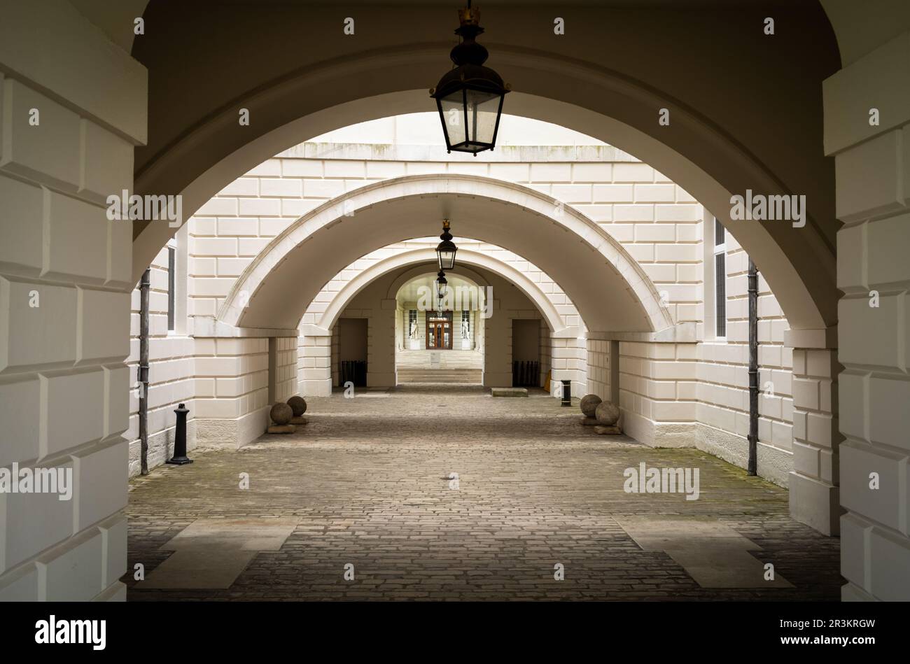 A cobbled and arched passageway underneath the Queen's House, now a ...