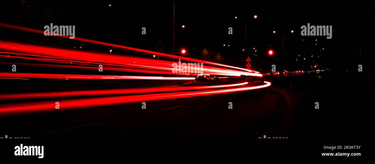 Lights of cars at night. Street line lights. Night highway city. Long ...