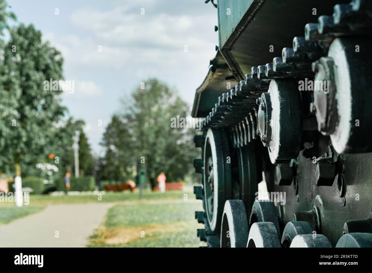 Old tank. Wheels and track closeup and peaceful background. Monument to ...