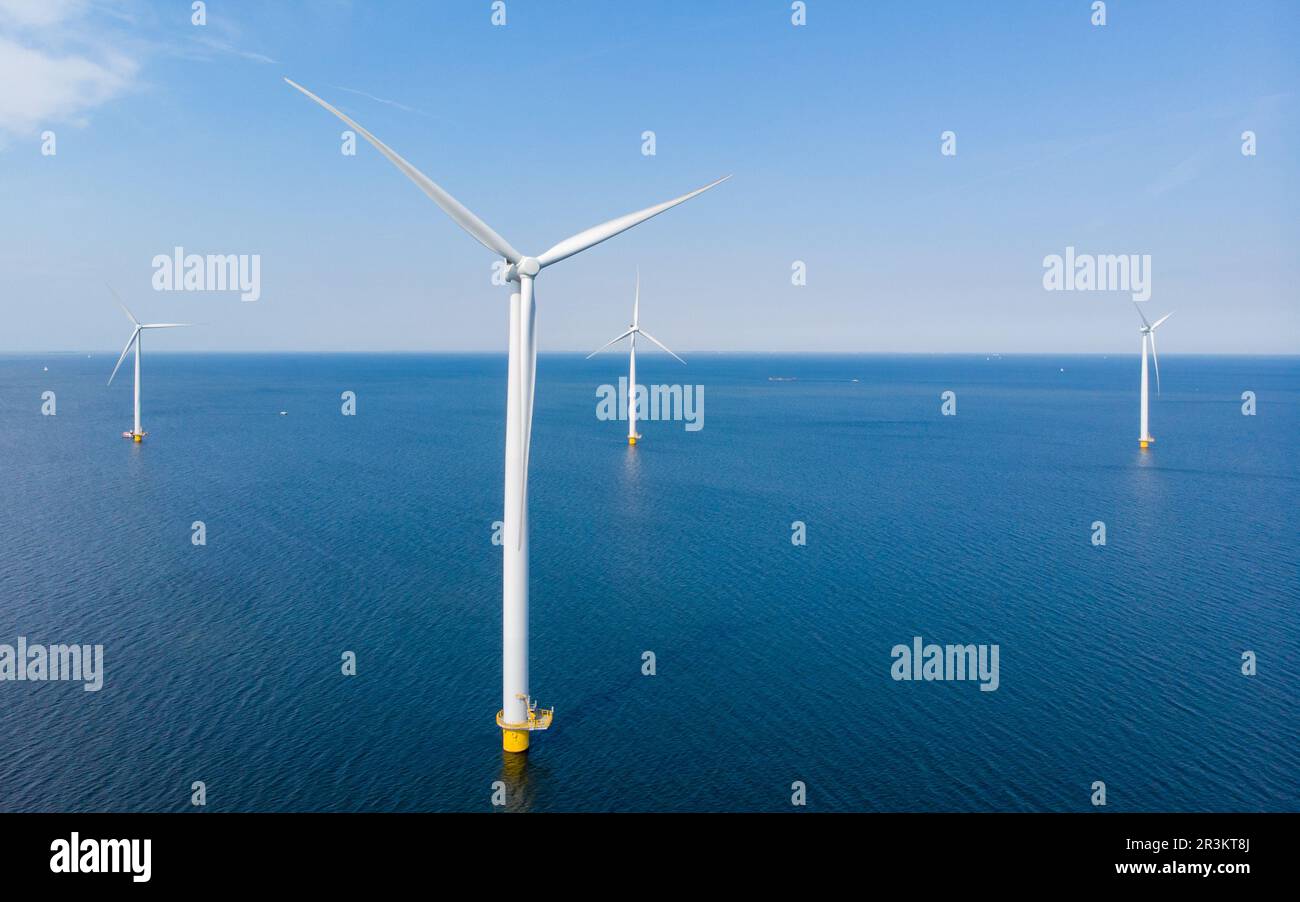 Windmill turbines at sea seen from a drone aerial view from above at a ...