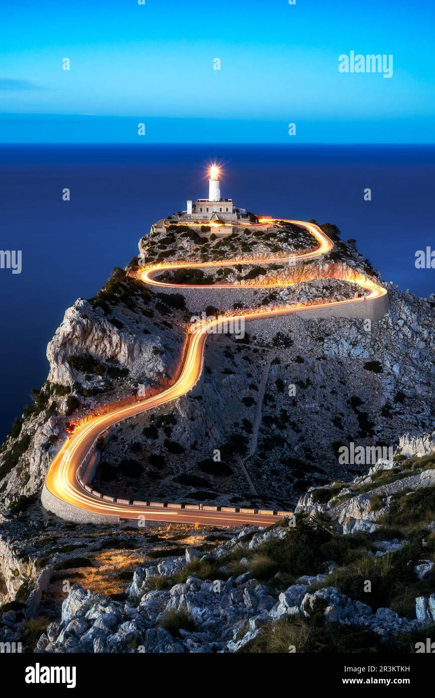 Cap Formentor lighthouse on Mallorca in the night with light rails ...