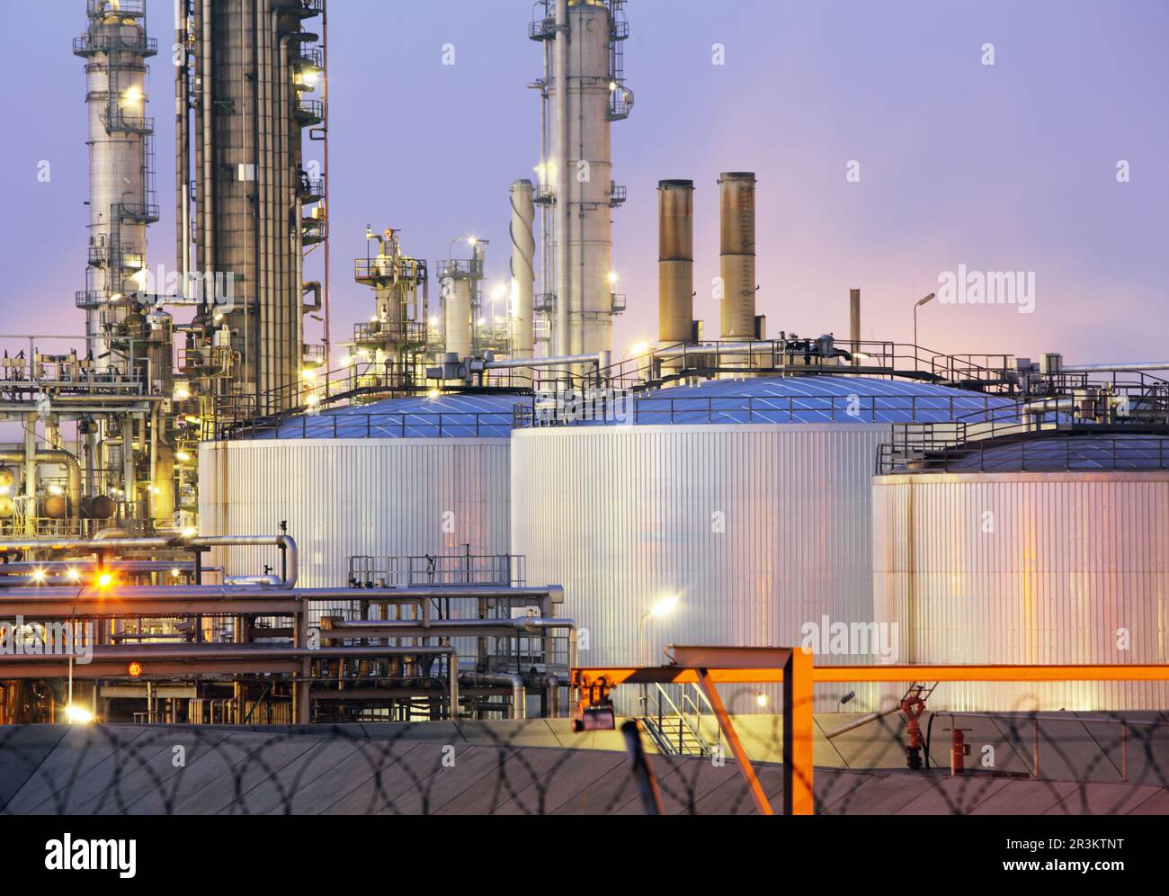 oil tank at night Stock Photo - Alamy