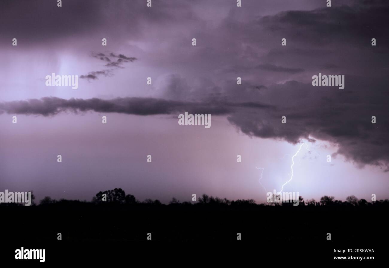 Lightning strike bolt storm storms clouds weather rain danger hi-res stock photography and ...