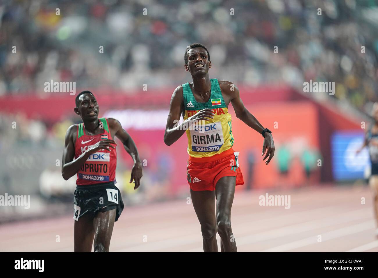 Lamecha Girma participating in the 3000 meter steeplechase at the Doha ...
