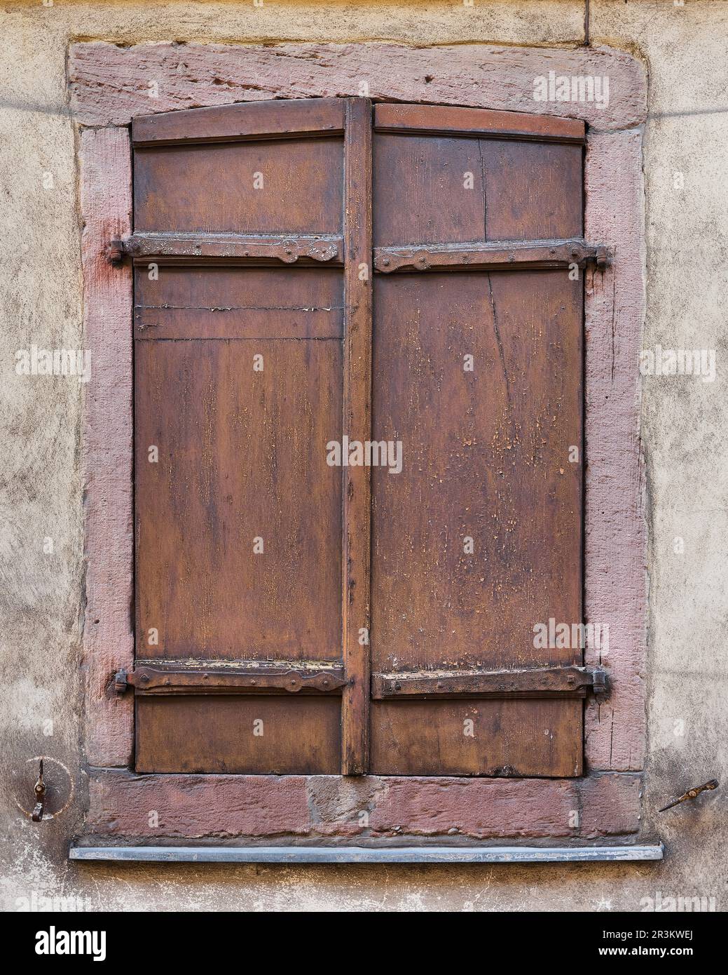 Old wooden window shutter on a historical building in the old town of ...