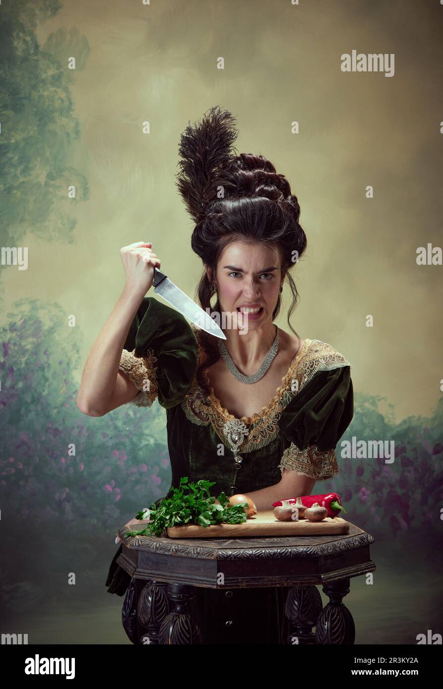 Portrait of young, emotional, angry girl, medieval princess holding ...