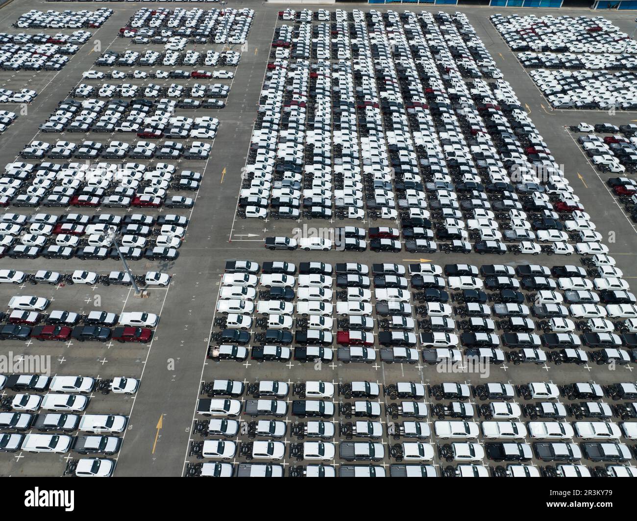 Aerial view of new cars stock at factory parking lot. Above view cars ...