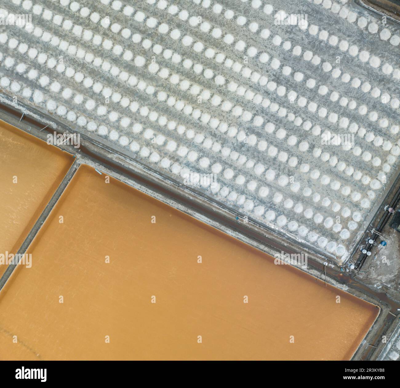 Aerial top view sea salt farm. Pile of brine salt. Raw material of salt ...