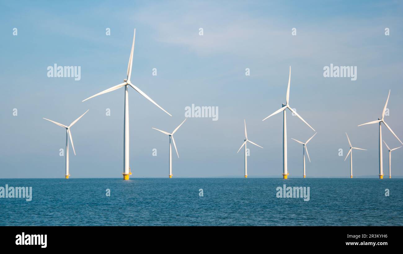 Windmill turbines at sea seen from a drone aerial view from above at a ...