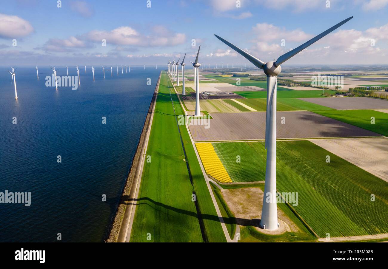 Windmill turbines at sea a huge winmill park in the Netherlands during ...