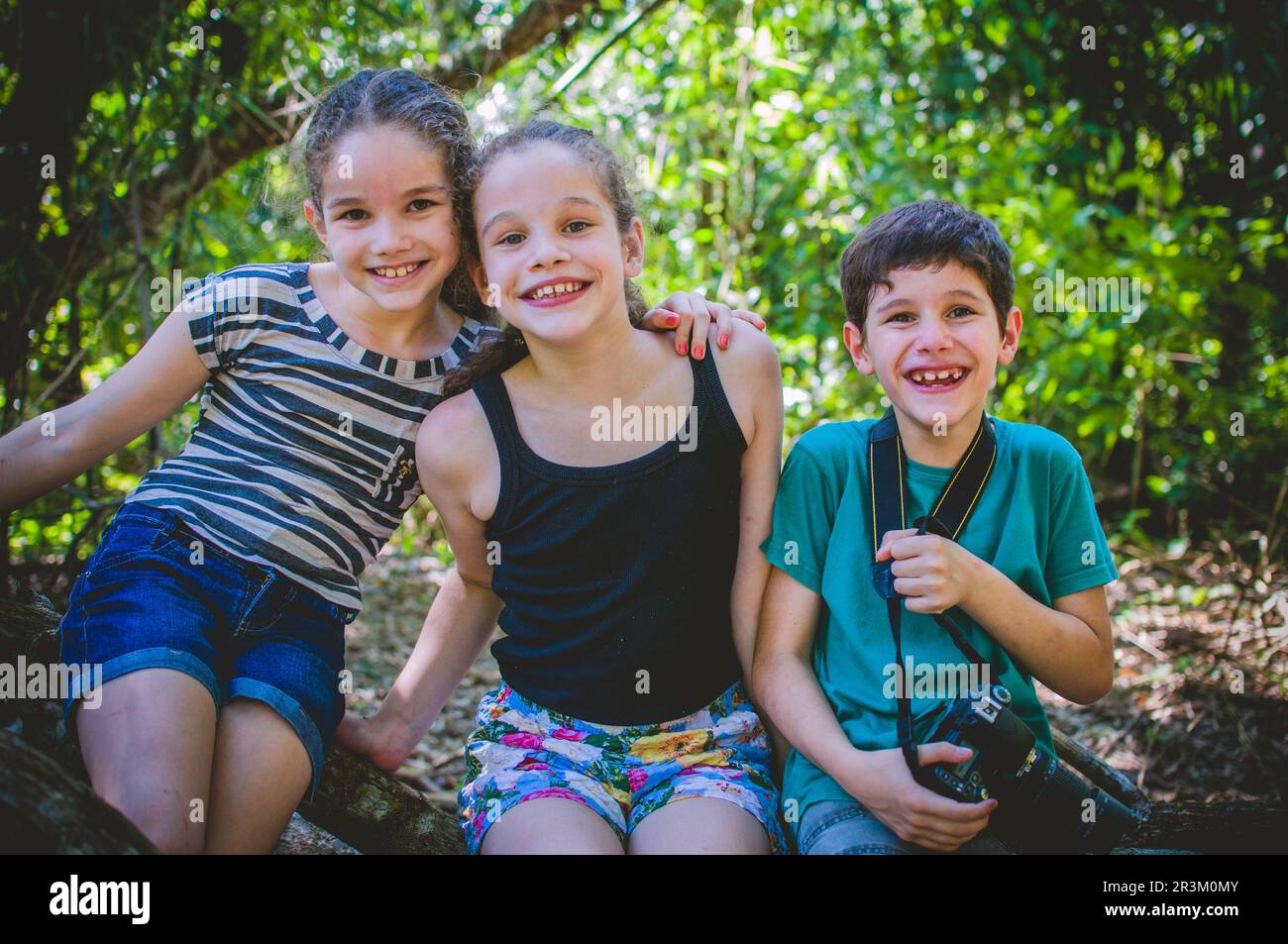 Portrait of children playing in the forest Stock Photo - Alamy