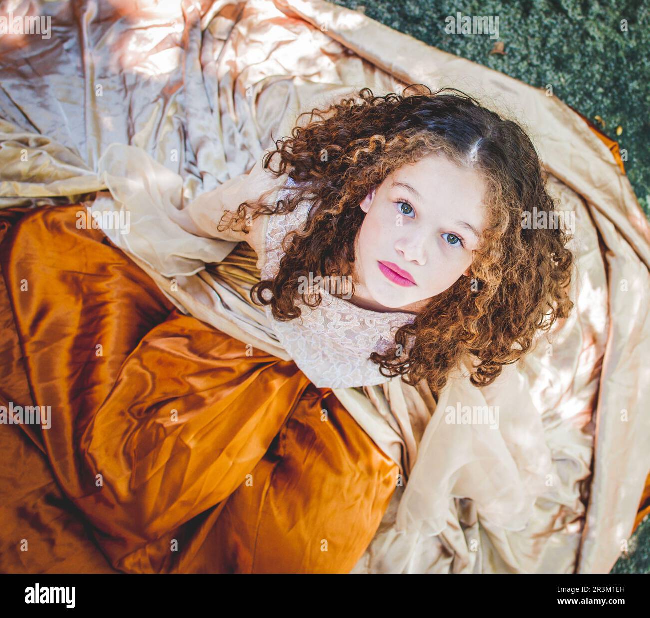 Girl seen from above looking at the camera Stock Photo - Alamy