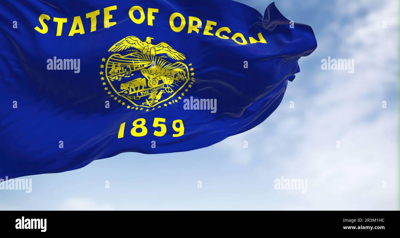 Close up view of the Oregon state flag waving on a clear day Stock ...