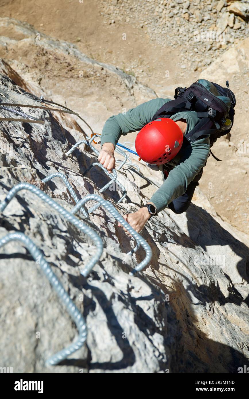 Climbing a ferrata route in San Blas, near the Arquillo reservoir in ...