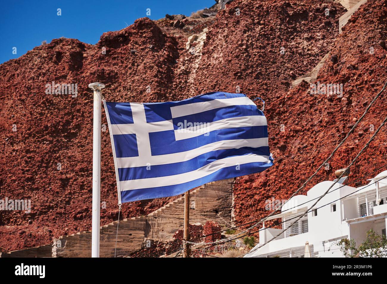 Greek Flag in Amoudy Bay Red Volcanic Cliffs - Oia Village - Santorini ...