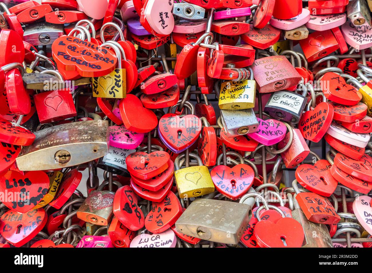 Verona, Italy - June 2022: background of heart-shaped locks on a wall ...