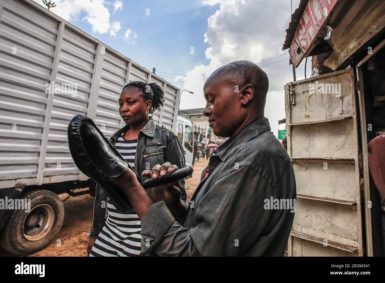 Nairobi, Kenya. 18th May, 2023. Daniel Mwangi, a local cobbler is ...