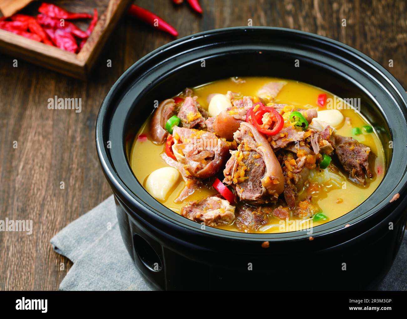 Delicious stewed mutton with radish in casserole Stock Photo - Alamy