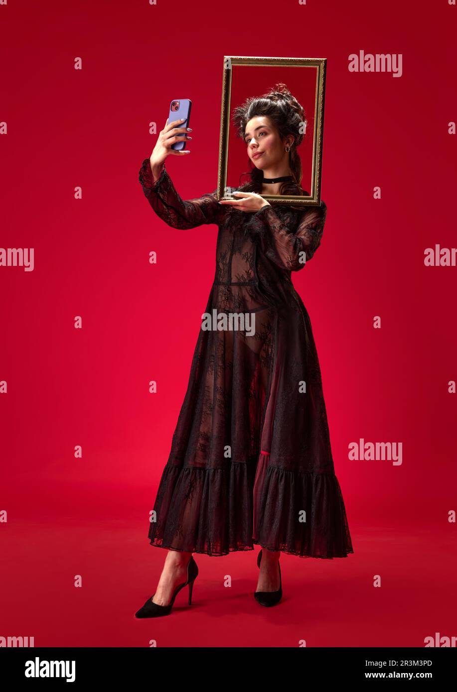 Full-length portrait of tender, beautiful, young girl holding picture ...