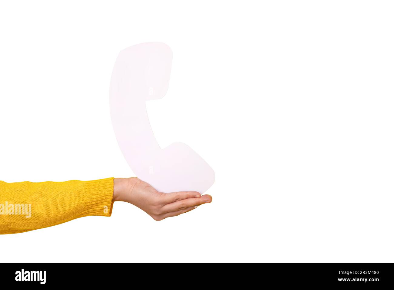 Hand holding symbol of telephone receiver isolated on white background ...