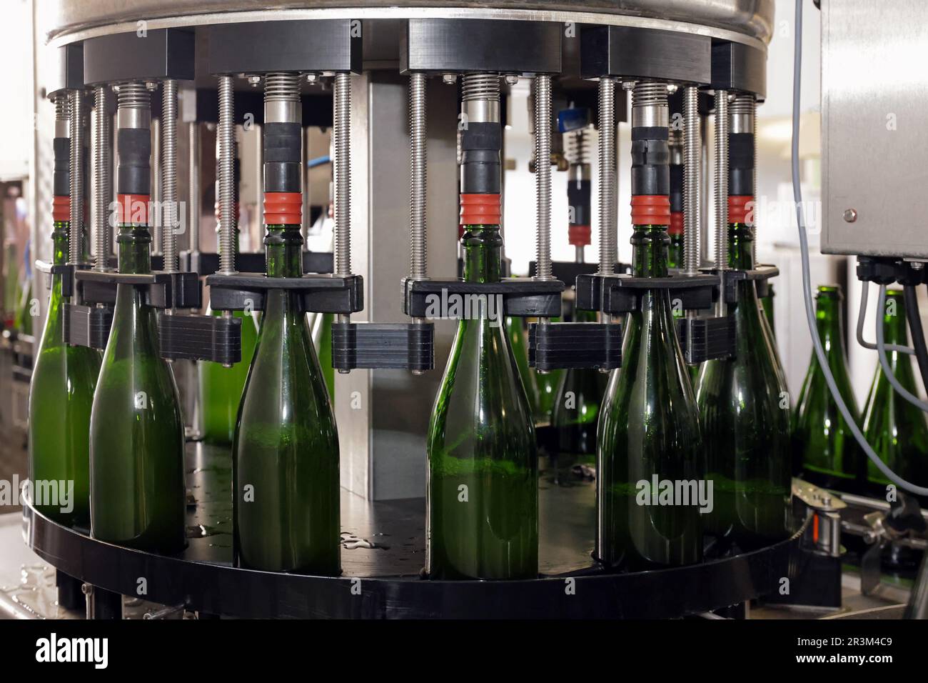 Wine bottles in the bottling line Stock Photo - Alamy