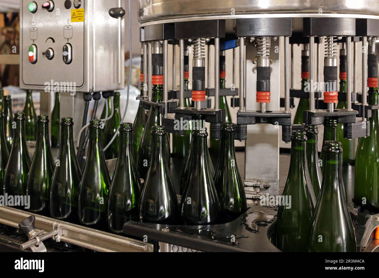 Wine bottles in the bottling line Stock Photo - Alamy