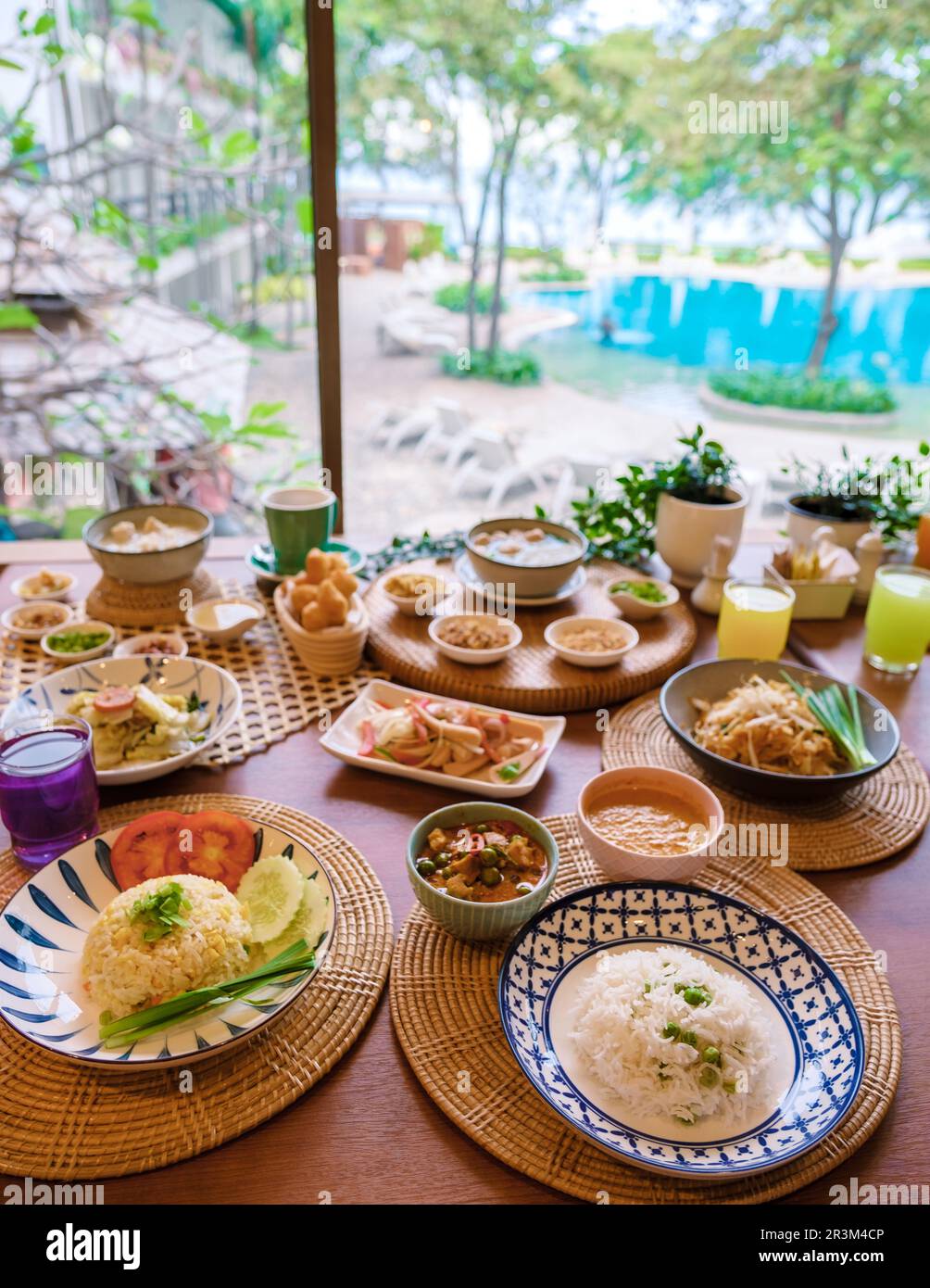Asian eating breakfast at hotel hi-res stock photography and images - Alamy