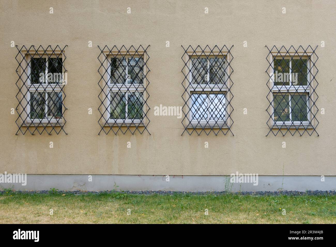 Facade with grating windows Stock Photo - Alamy