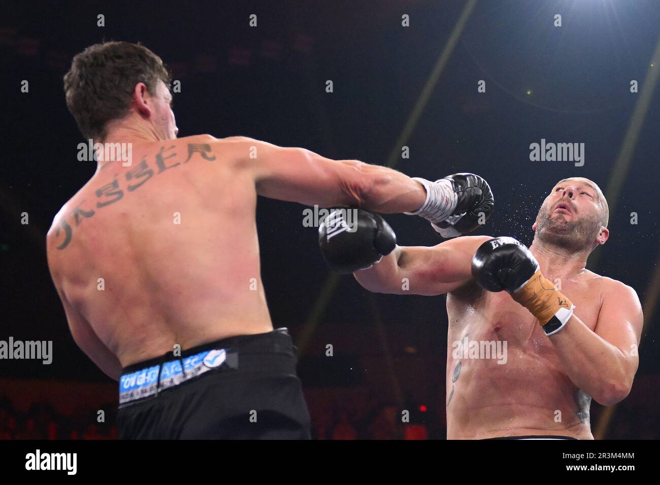 Cameron Mooney (left) fights Tom Bellchambers during their Heavyweight ...