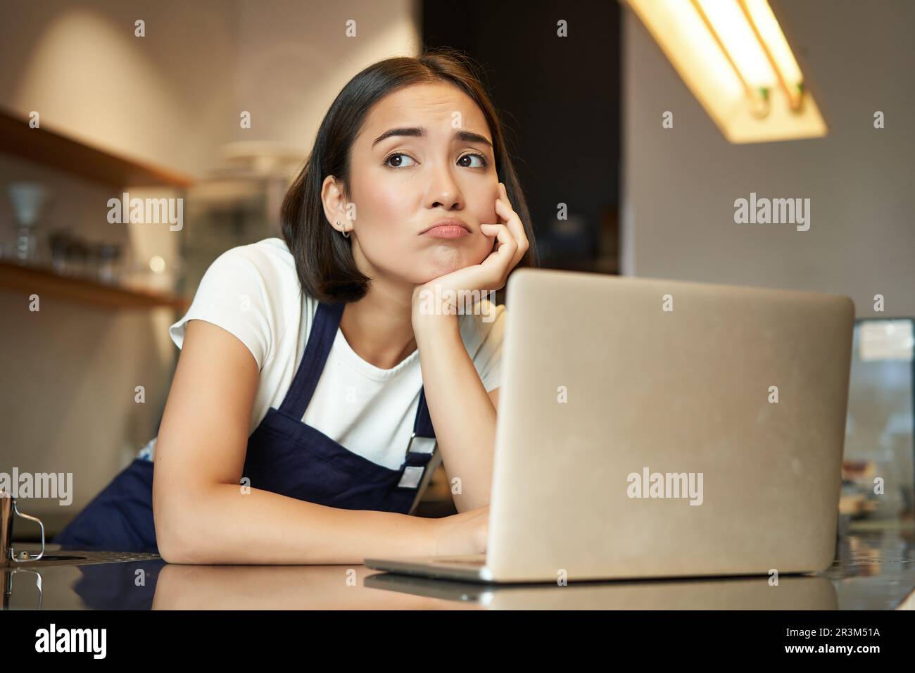 Woman shop counter sad hi-res stock photography and images - Alamy
