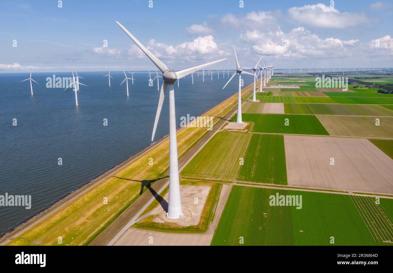 Windmill turbines at sea a huge winmill park in the Netherlands during ...