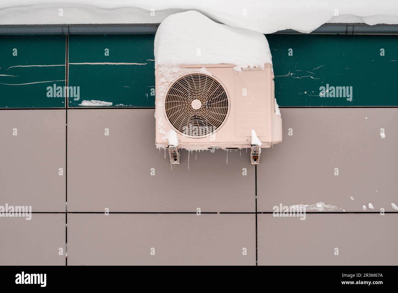 An outdoor air conditioner unit installed on the outer wall of a ...