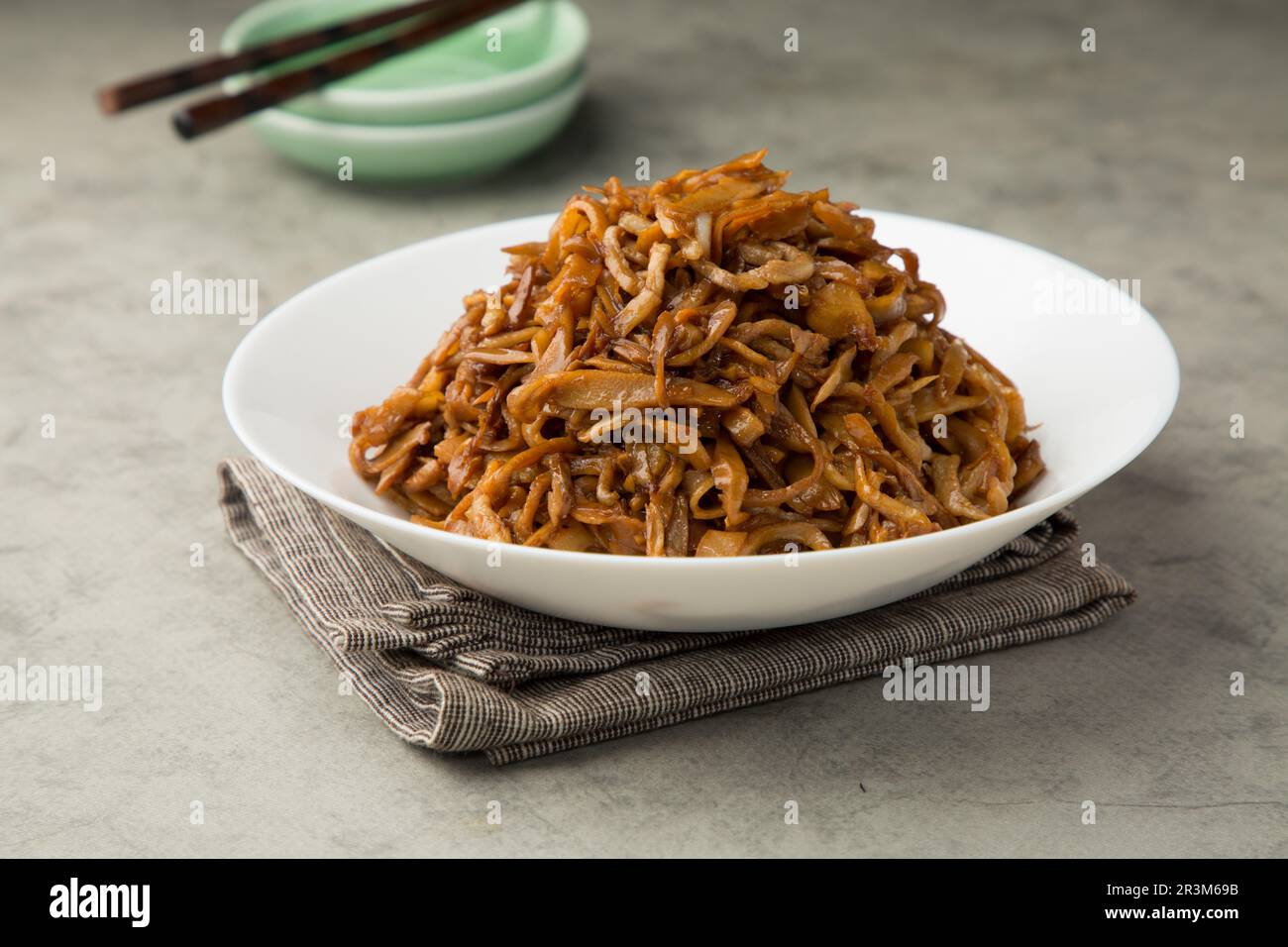 Stir fried smoked bamboo shoots Stock Photo - Alamy