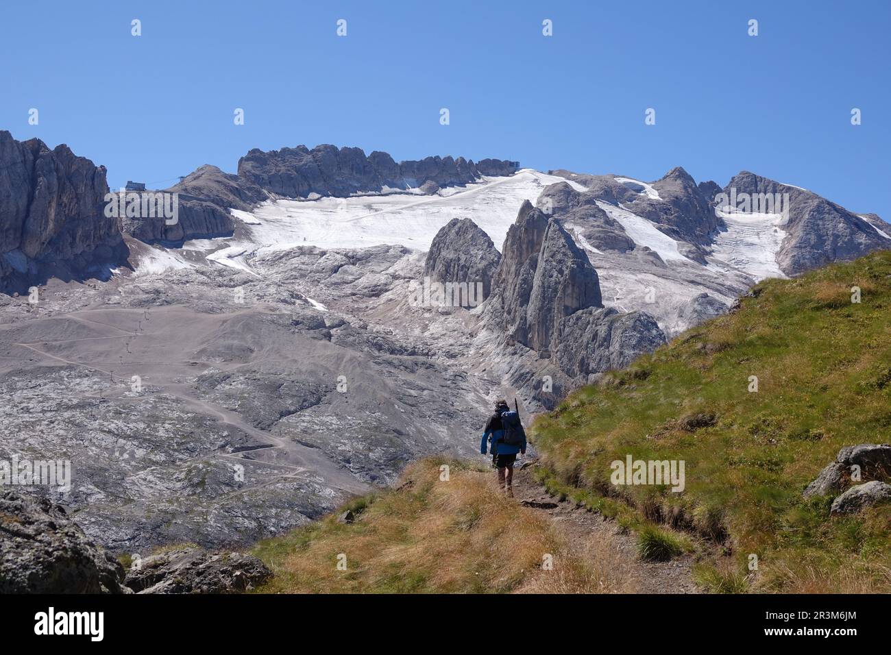 Hikers on the Padon ridge, view to Marmolada Stock Photo - Alamy