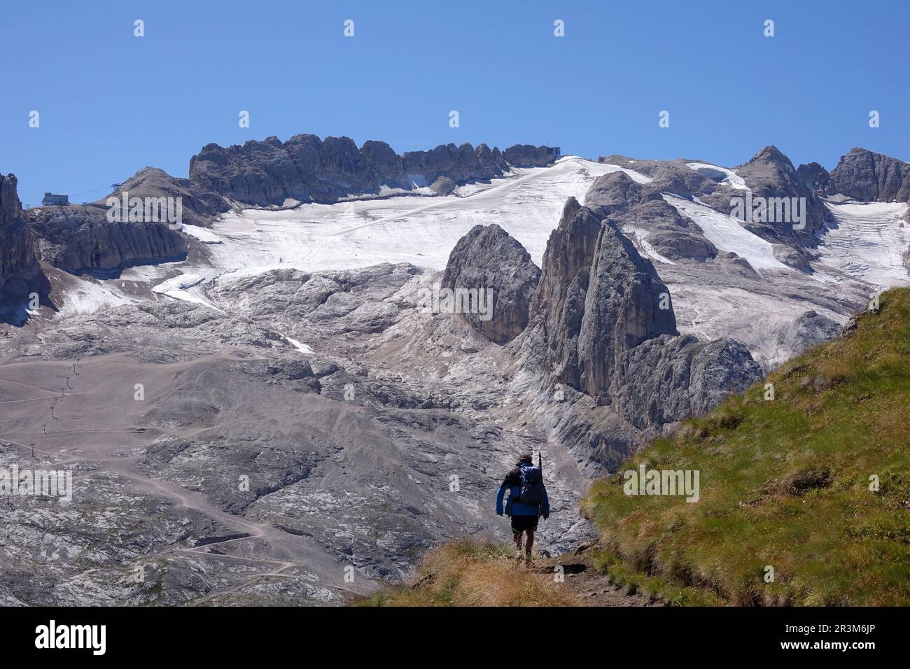 Hikers on the Padon ridge, view to Marmolada Stock Photo - Alamy