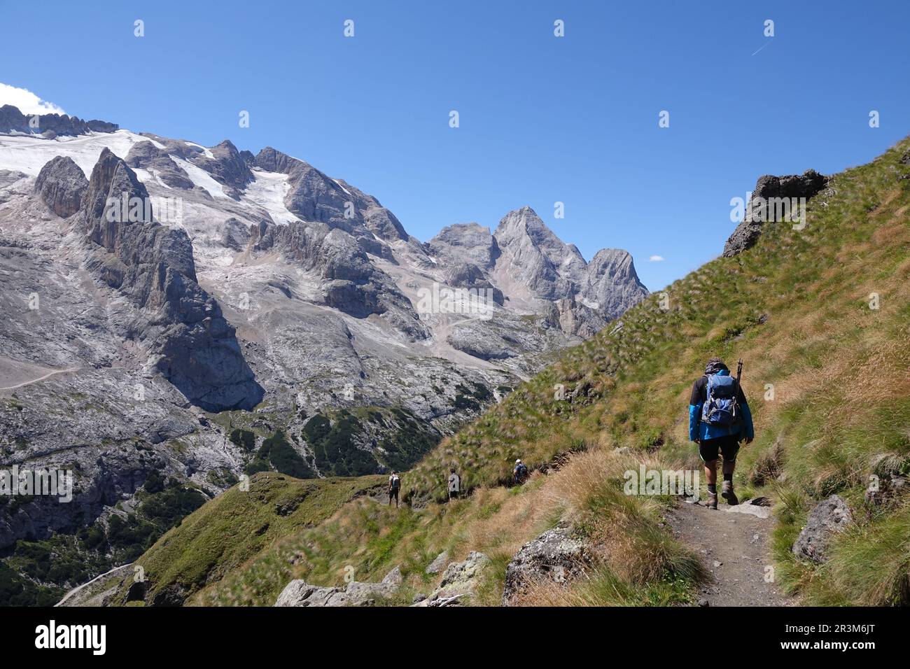 Hikers on the Padon ridge, view to Marmolada Stock Photo - Alamy