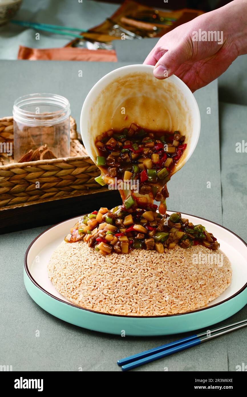 Crispy rice with beef in bisque Stock Photo - Alamy