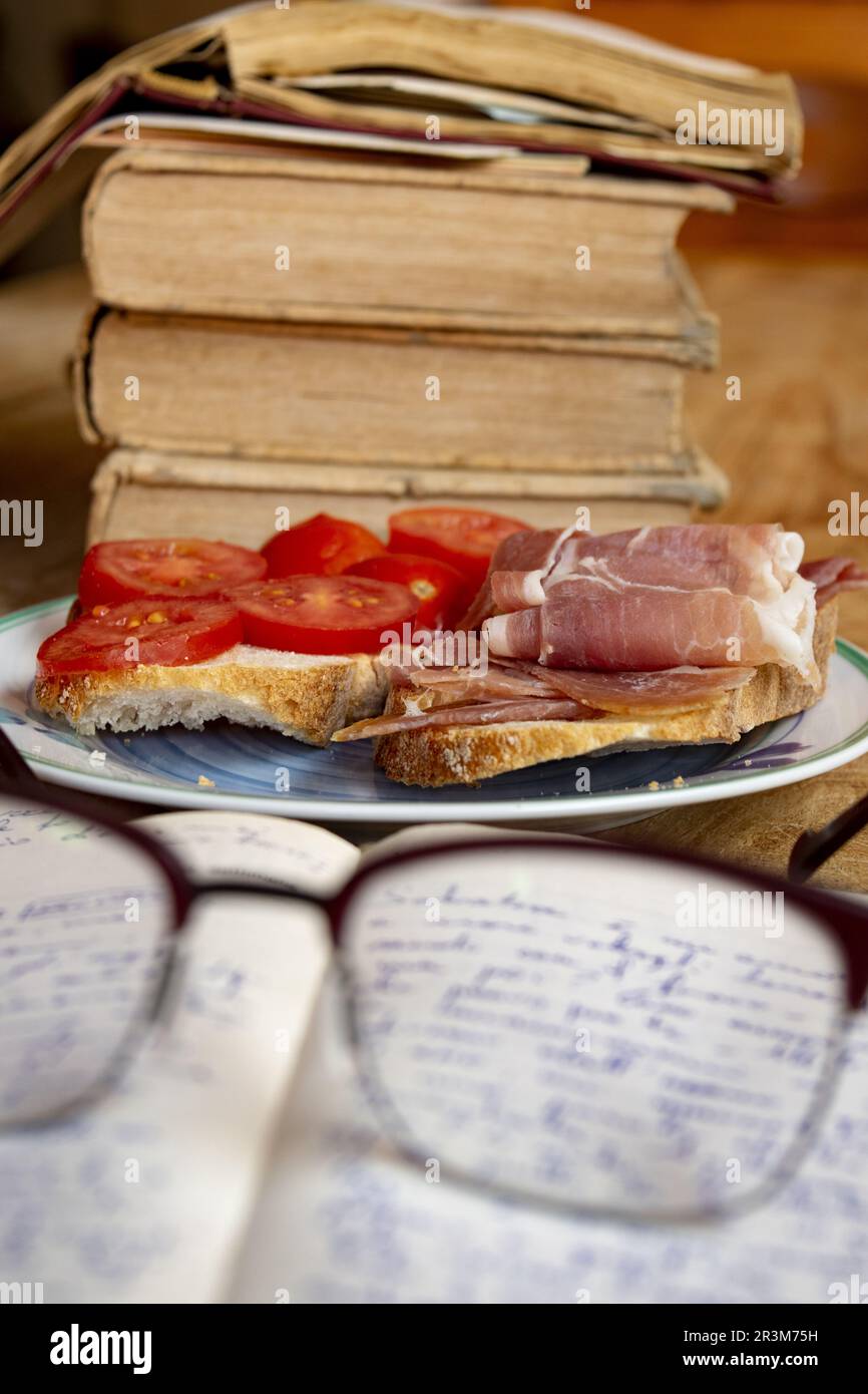 concept of concentration and fast snack while reading and writing Stock ...