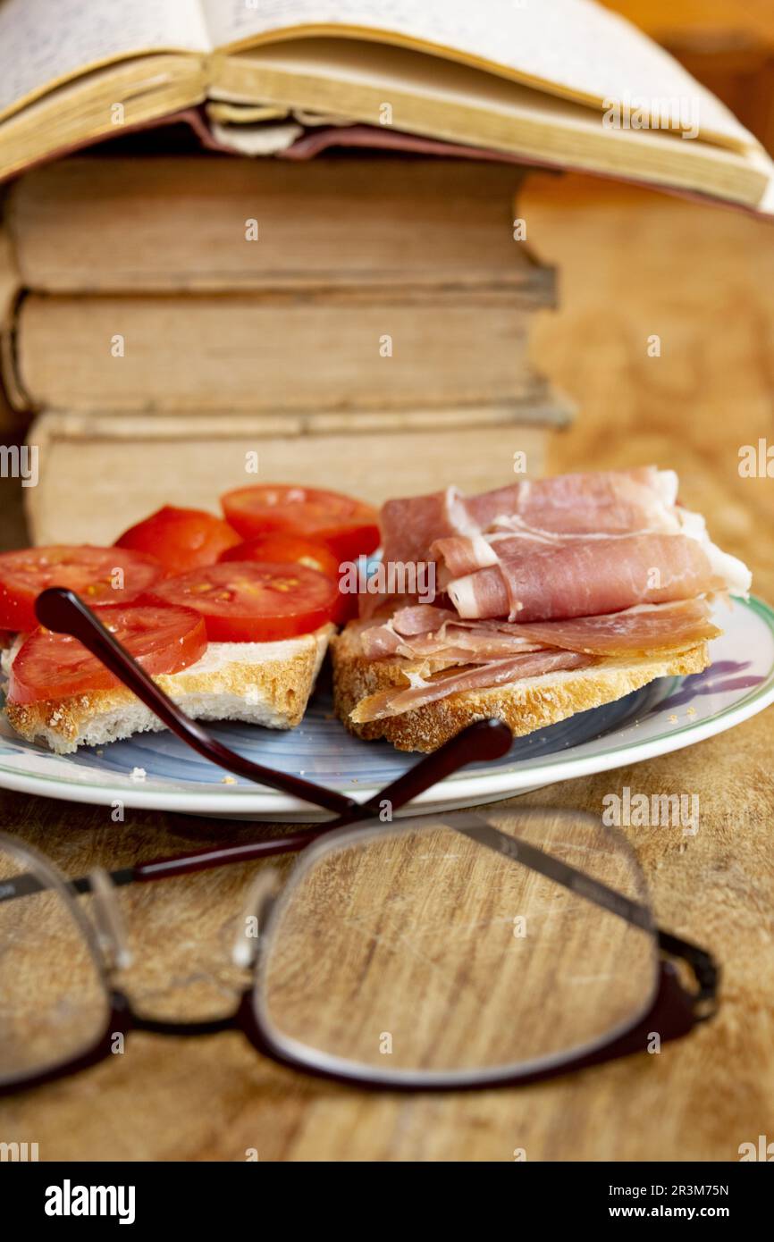 concept of concentration and fast snack while reading and writing Stock ...