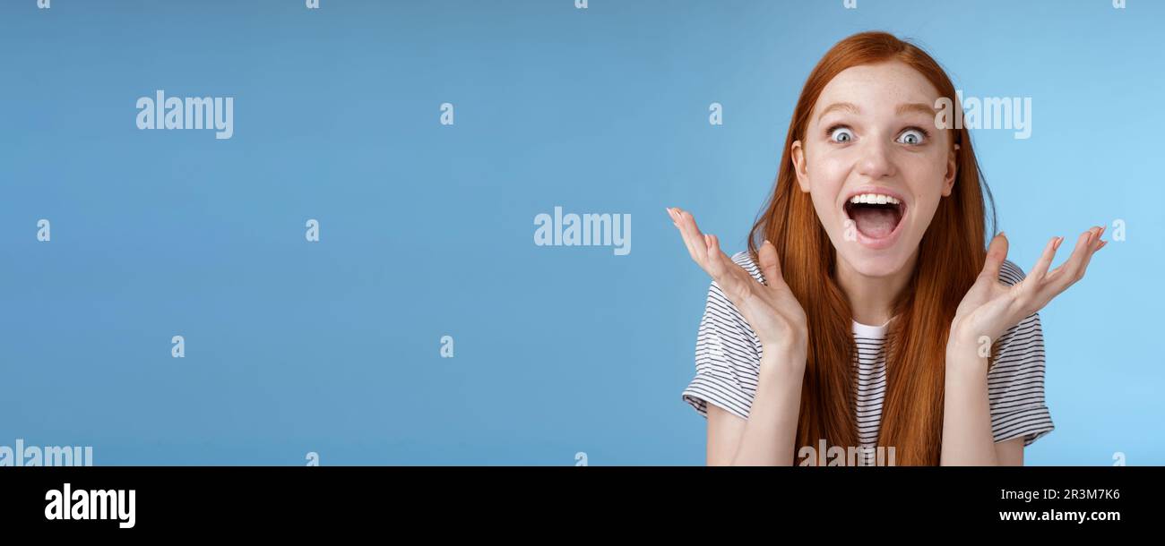 Excited overwhelmed young attractive female redhead fan go nuts ...