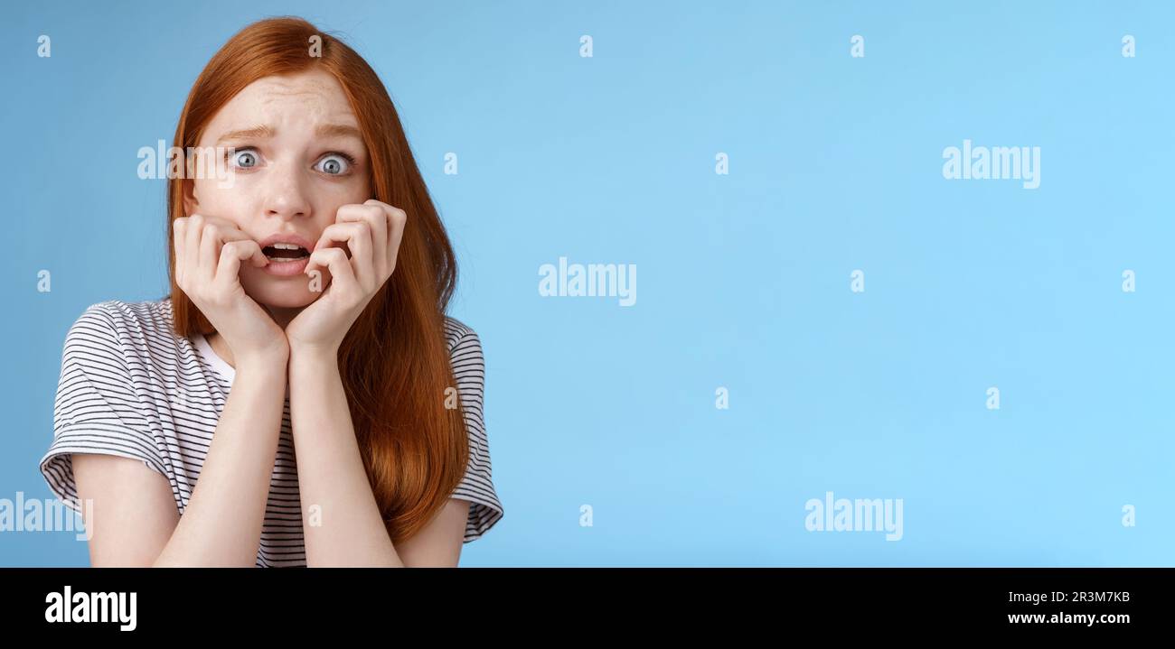 Scared speechless stunned frightened redhead girl trembling fear wide ...