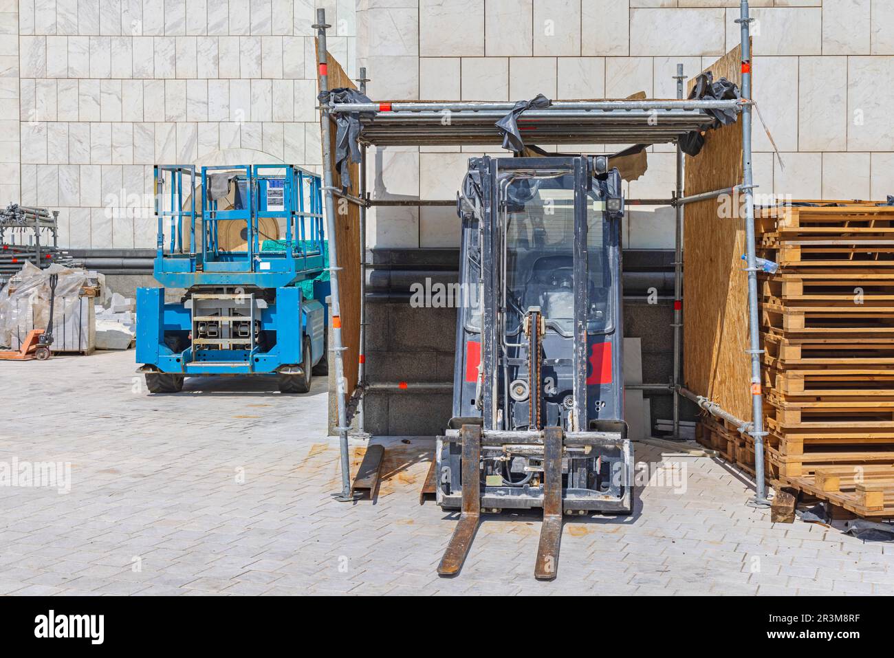 Forklift in Improvised Cover Garage and Aerial Work Platform at ...
