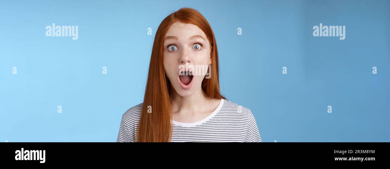 Wow so cool. Impressed speechless amused attractive redhead girl blue ...