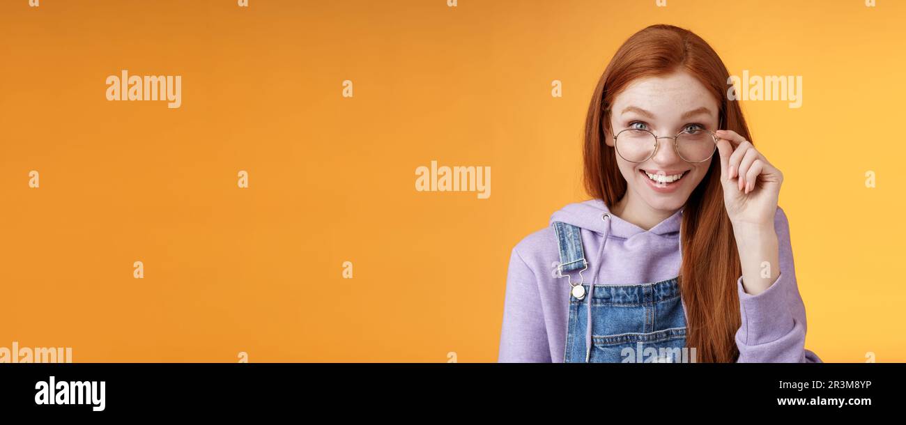 Charming silly modest young redhead female geek game lover discus last ...
