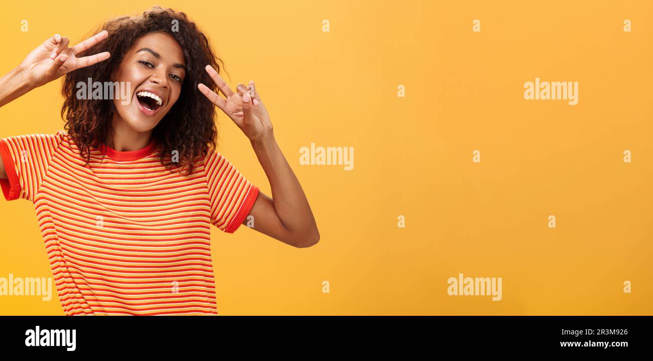 Nobody gonna spoil my perfect mood. Portrait of happy optimistic attractive dark-skinned female ...