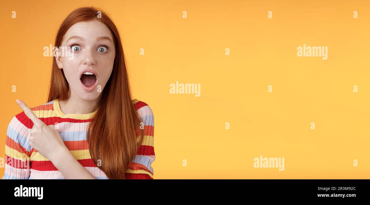 Impressed speechless young redhead 20s girl drop jaw gasping amused ...