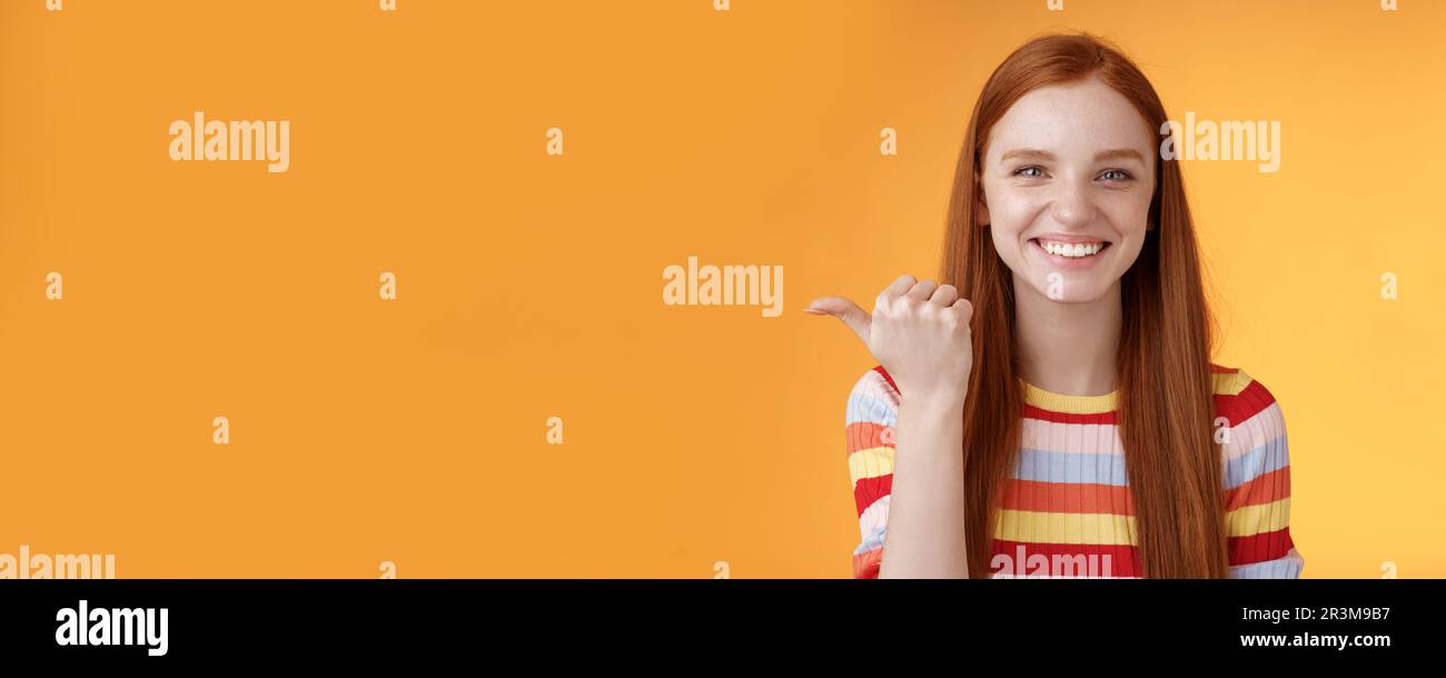 Girl pointing left cool person can help smiling delighted look friendly ...